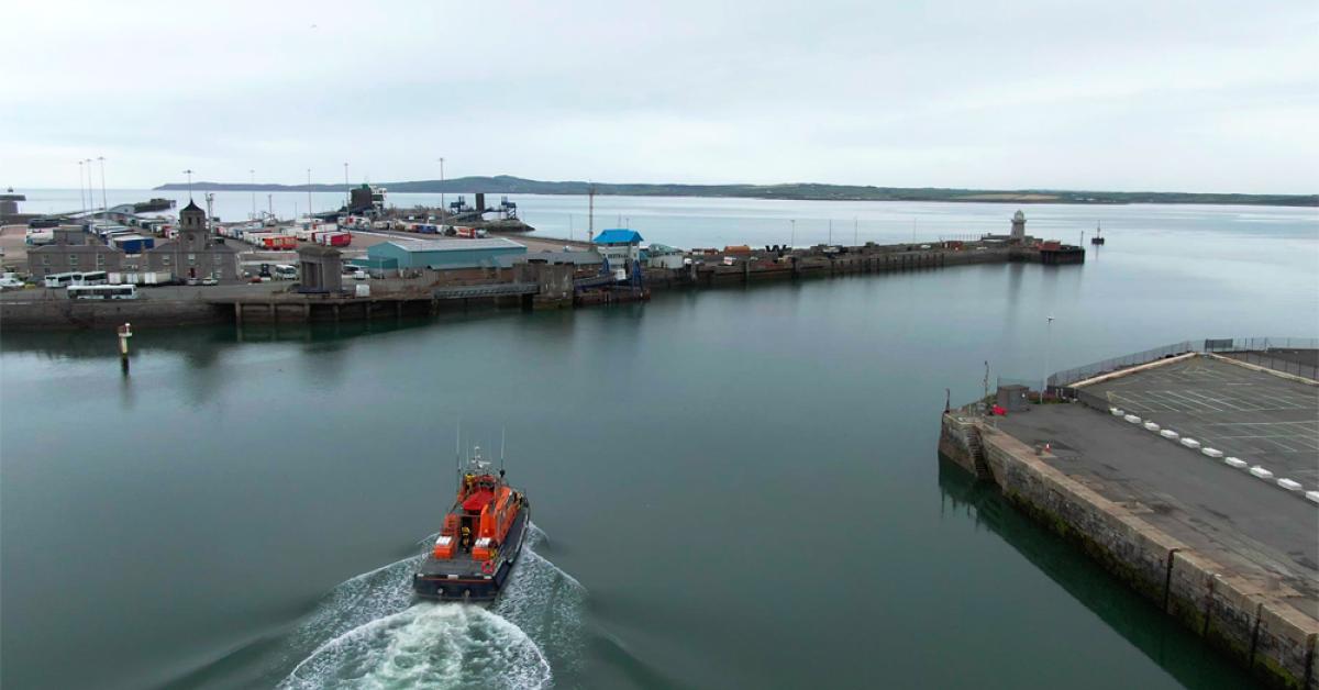 Aerial view of Holyhead RNLI boat leaving Holyhead port. | People's ...